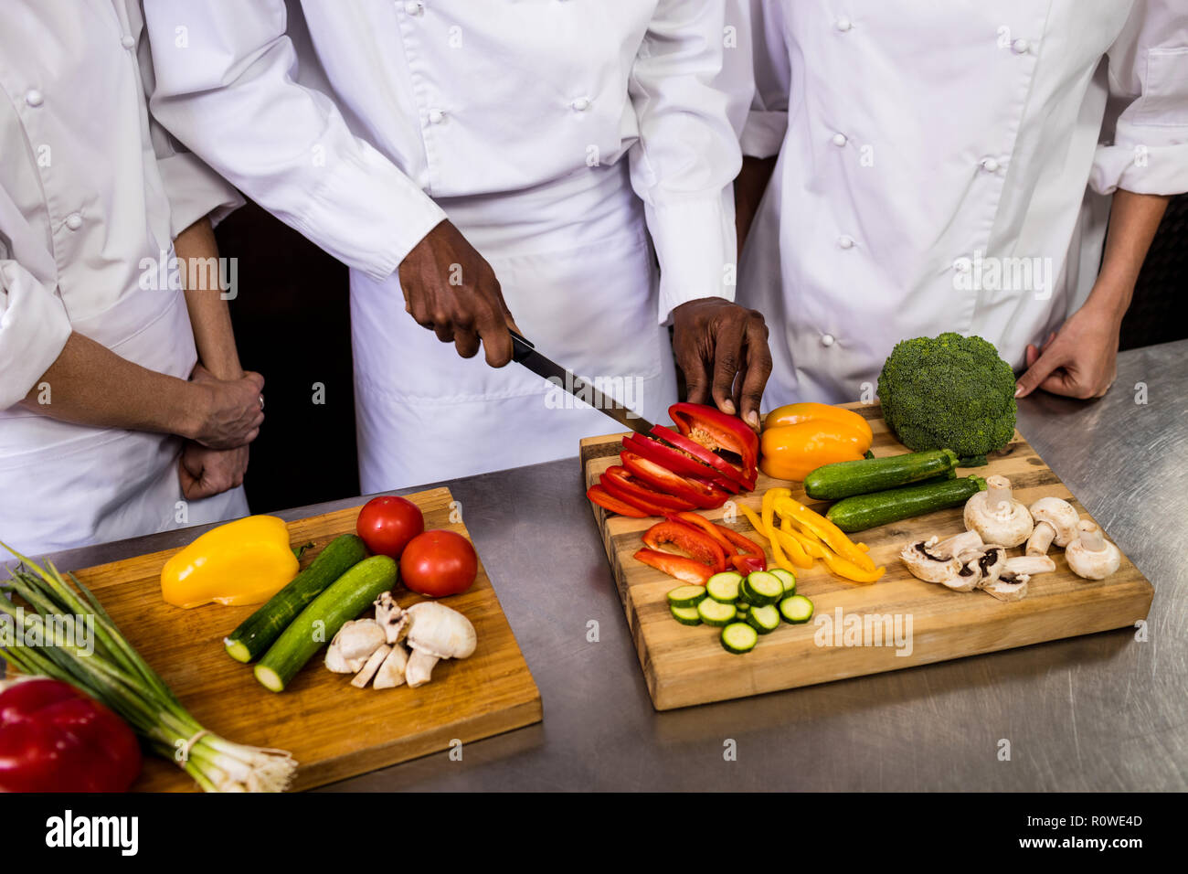 Chef chopping vegetable in kitchen Stock Photo - Alamy