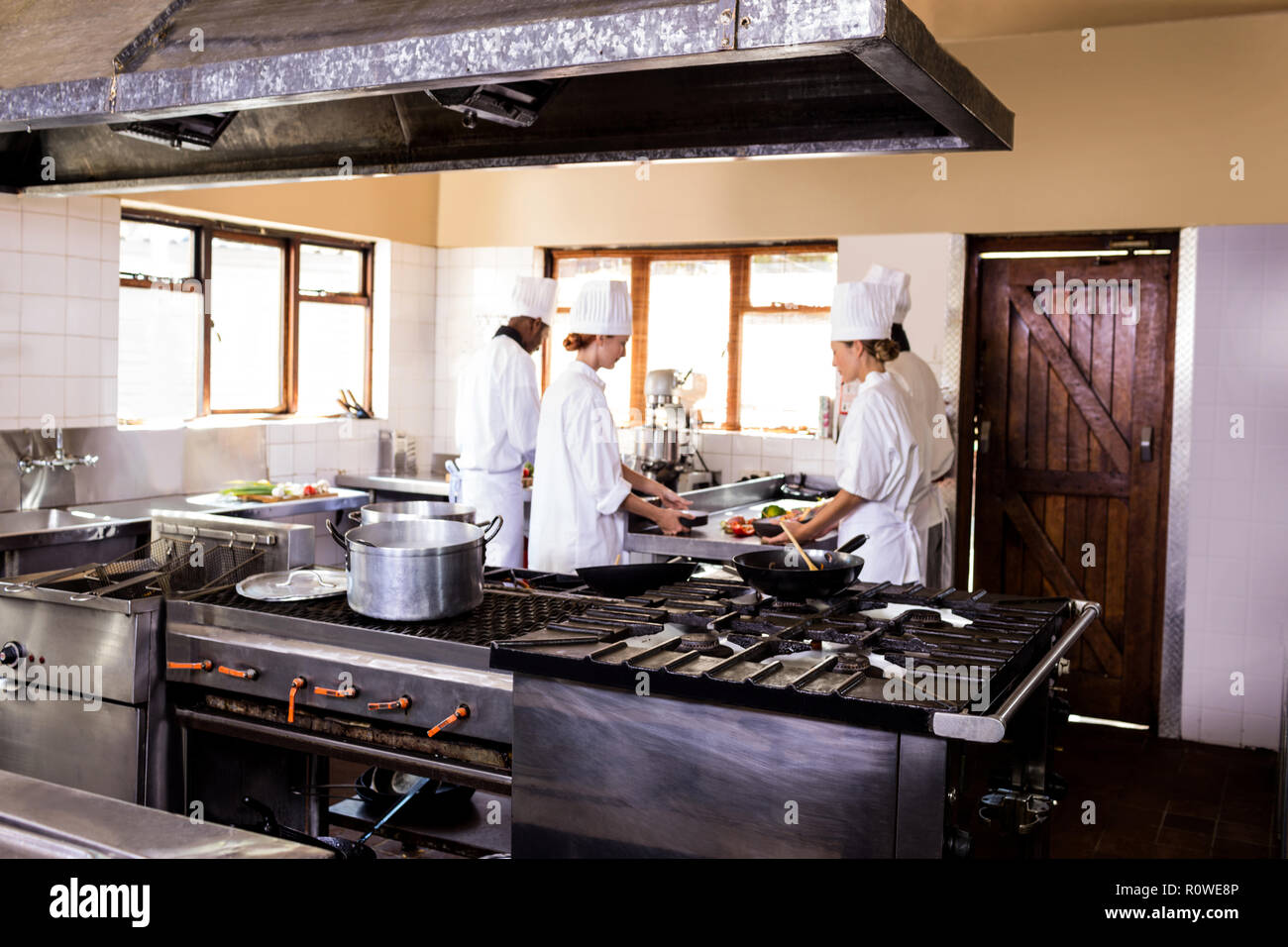 Working in kitchen hi-res stock photography and images - Alamy