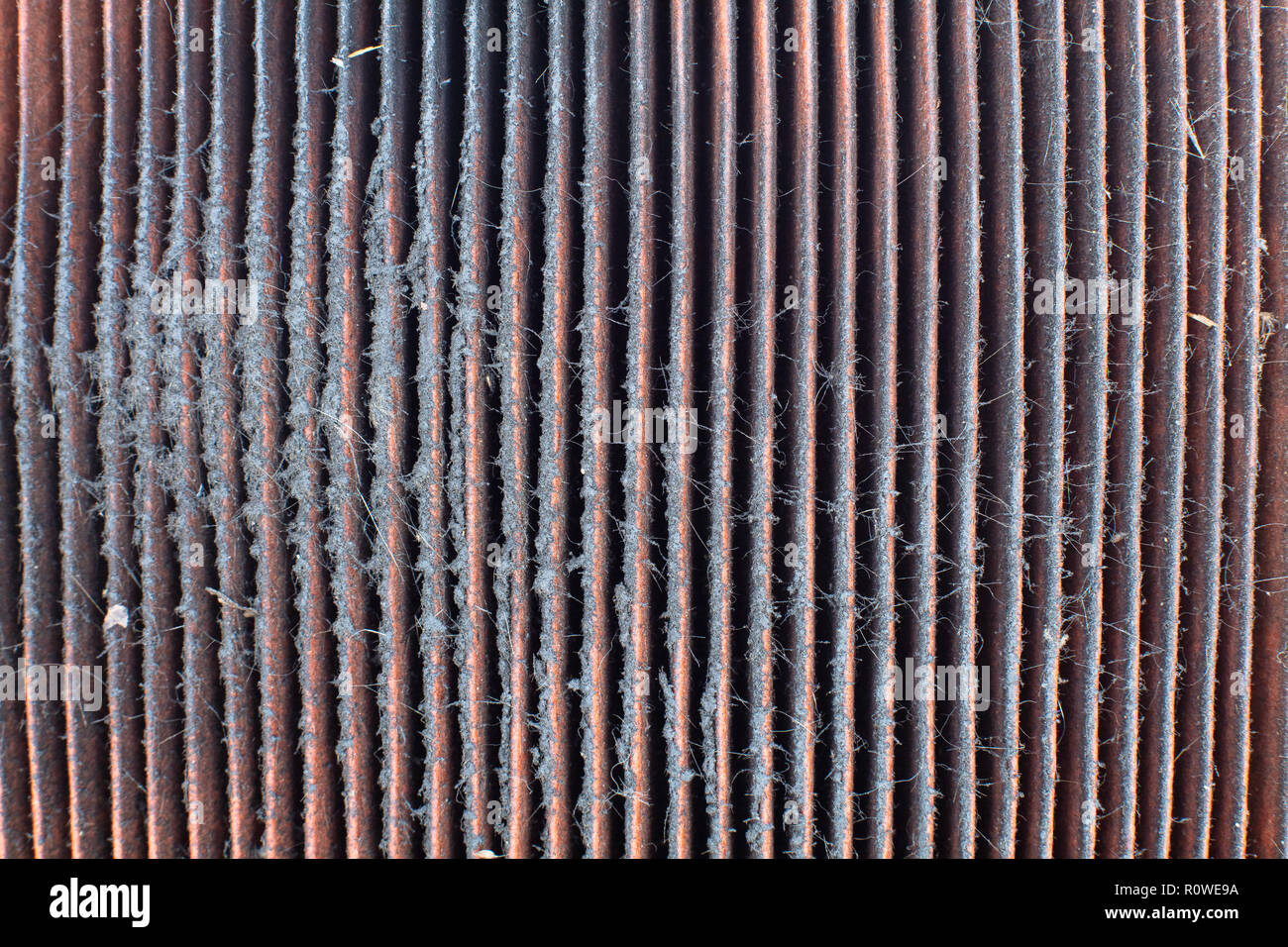 Changing an air filter . Detail, Dirty, clogged air filter surface ...