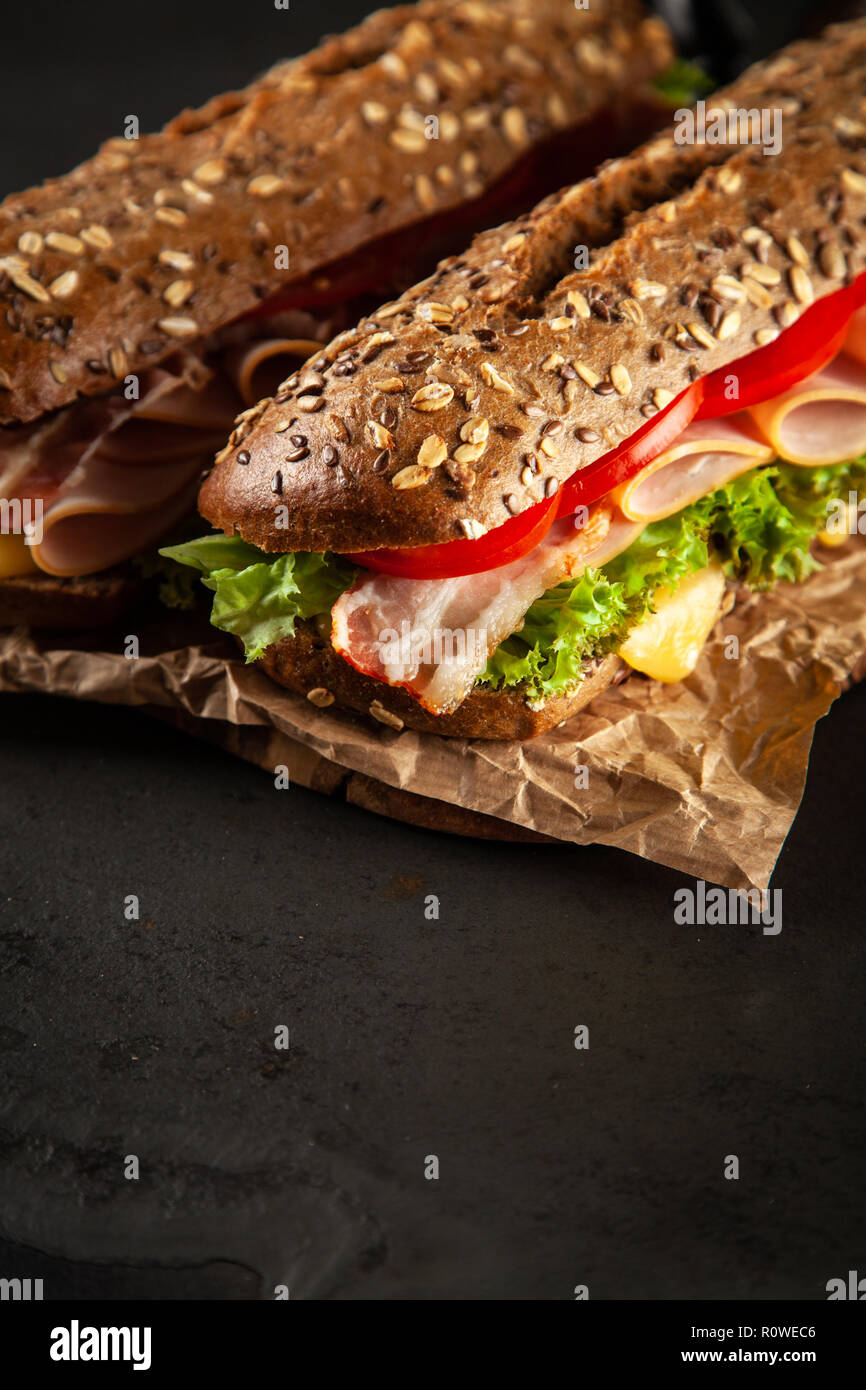 Classic BLT sandwiches on dark background Stock Photo - Alamy