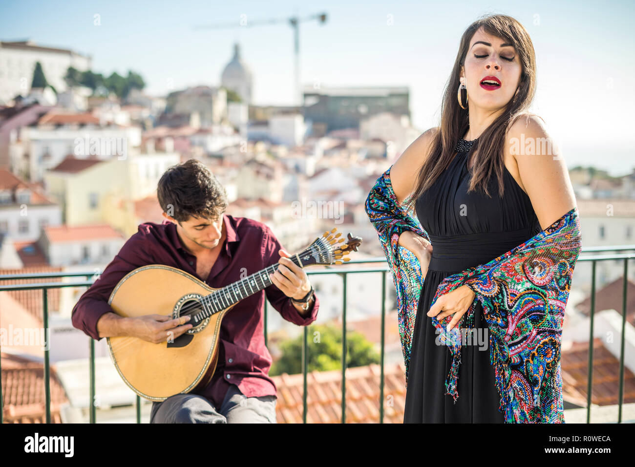 Beautiful fado singer performing with handsome portuguese guitarist ...