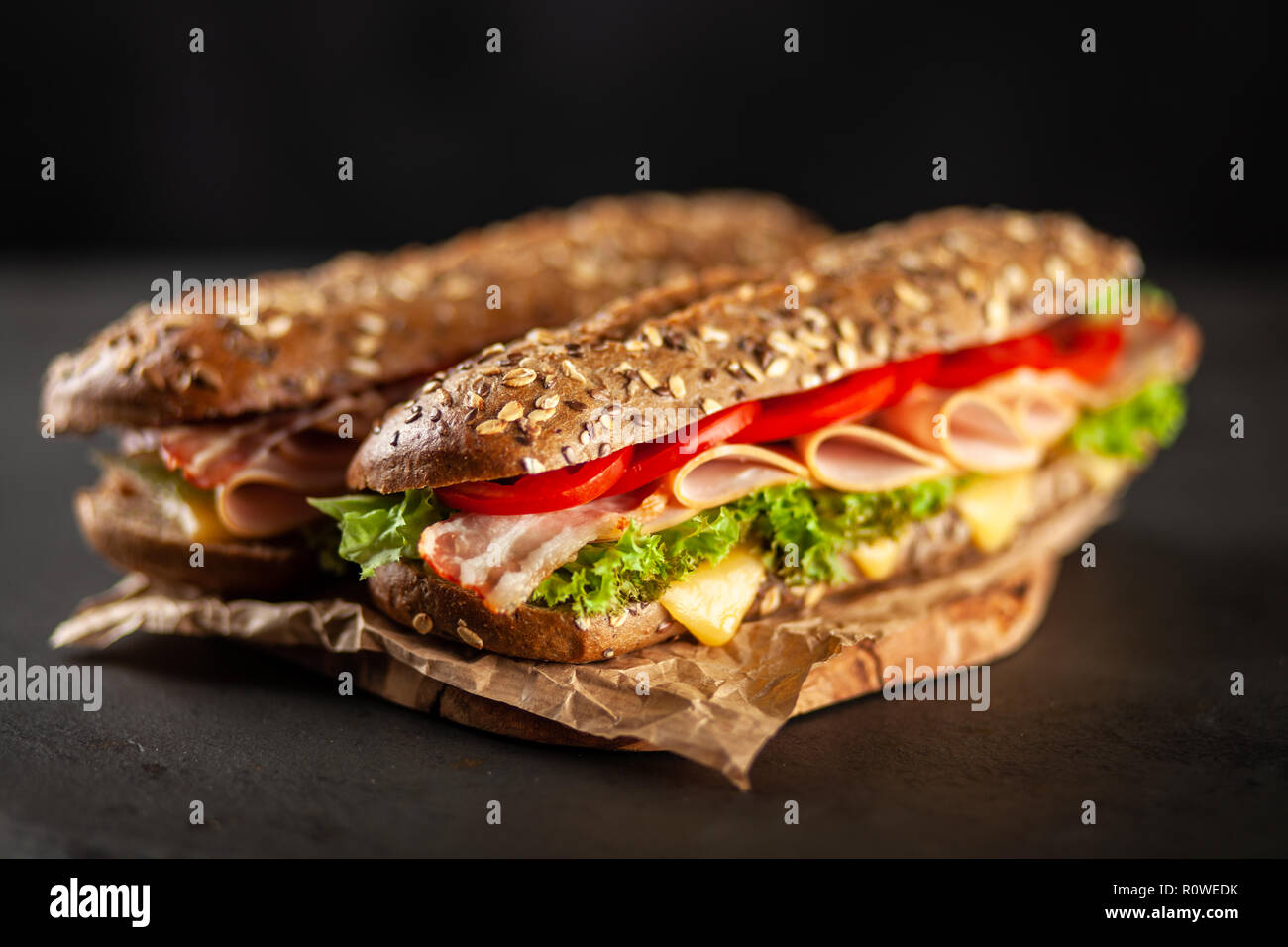 Classic BLT sandwiches on dark background Stock Photo - Alamy
