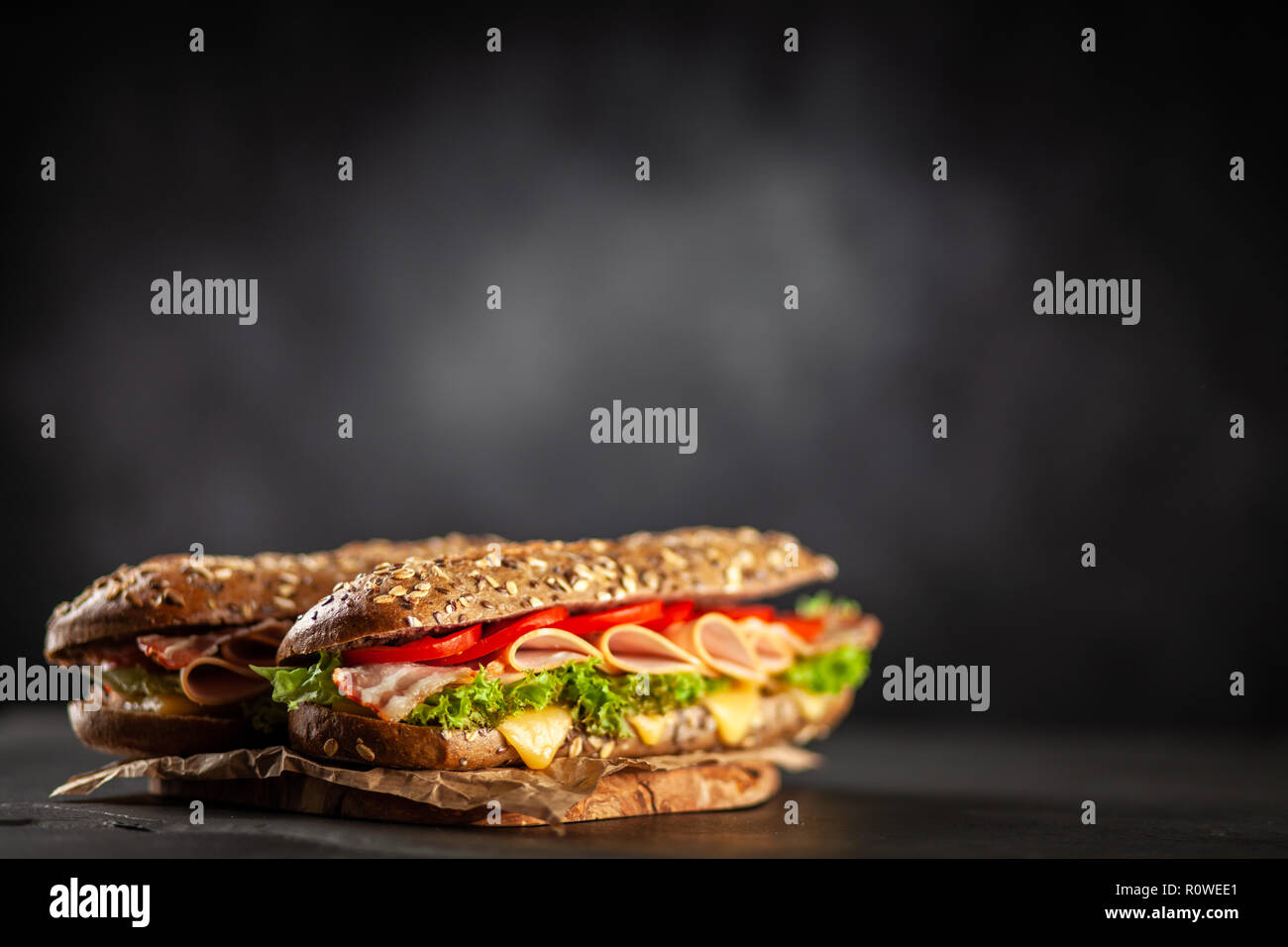 Classic BLT sandwiches on dark background Stock Photo - Alamy