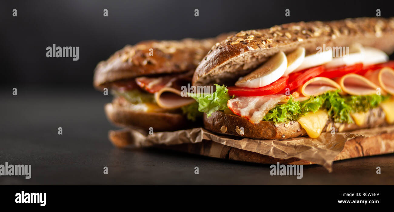 Classic BLT sandwiches on dark background Stock Photo - Alamy