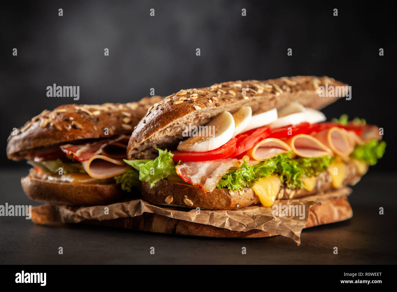 Classic BLT sandwiches on dark background Stock Photo - Alamy