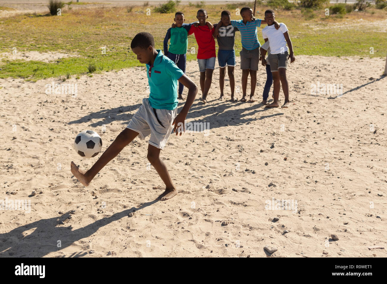 Boy playing football hi-res stock photography and images - Alamy