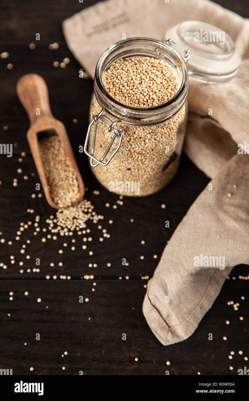 Raw quinoa seeds in a glass container Stock Photo - Alamy