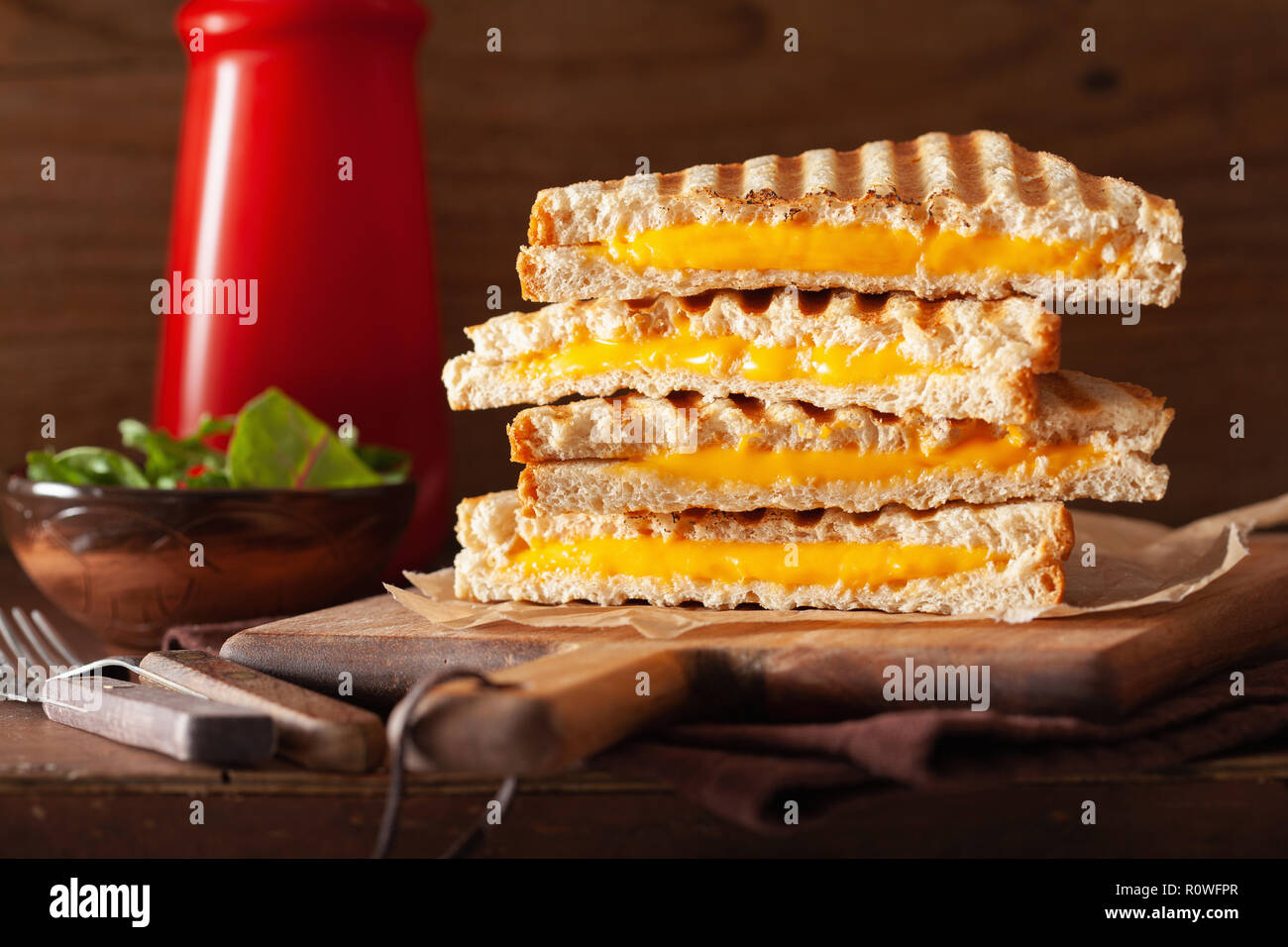 grilled cheese sandwich on rustic brown background Stock Photo - Alamy