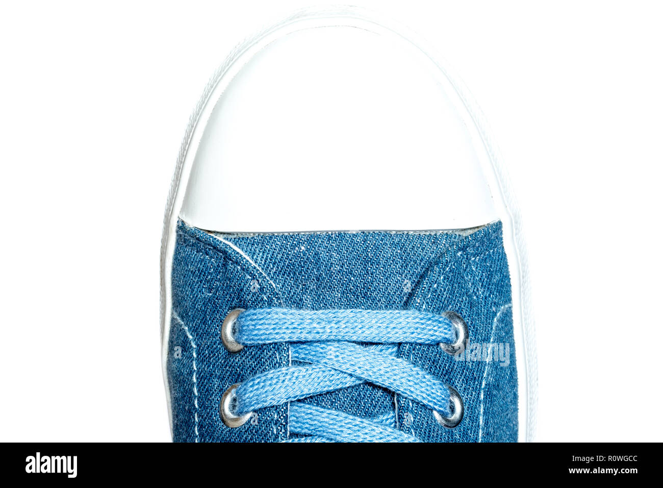 Denim sneakers close-up macro texture isolated on white background ...