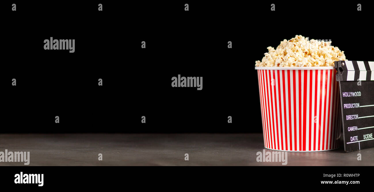 Full popcorn bucket on a dark background Stock Photo - Alamy