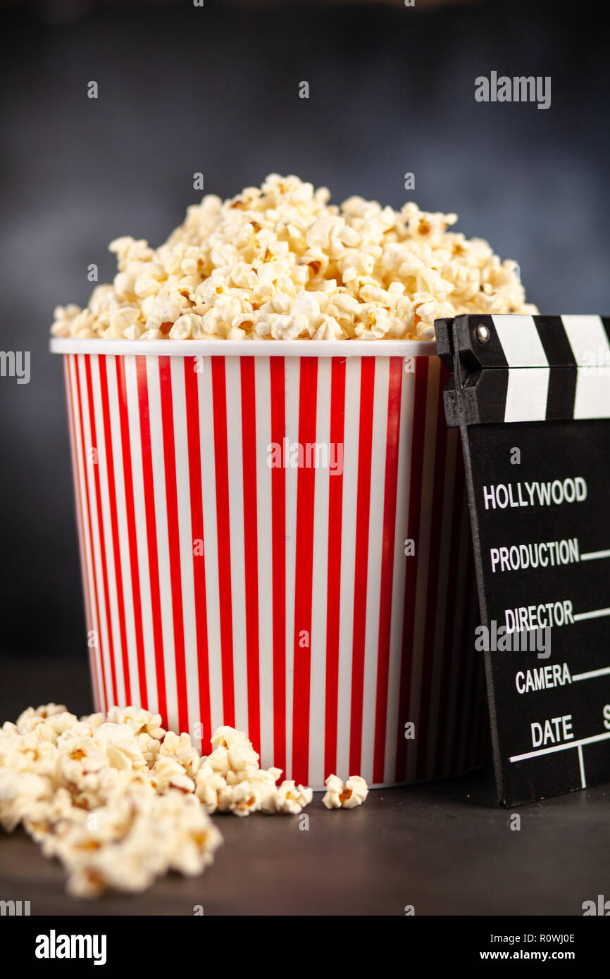 Full popcorn bucket on a dark background Stock Photo - Alamy