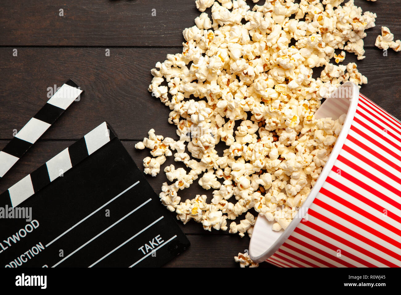 Full popcorn bucket on a dark background Stock Photo - Alamy