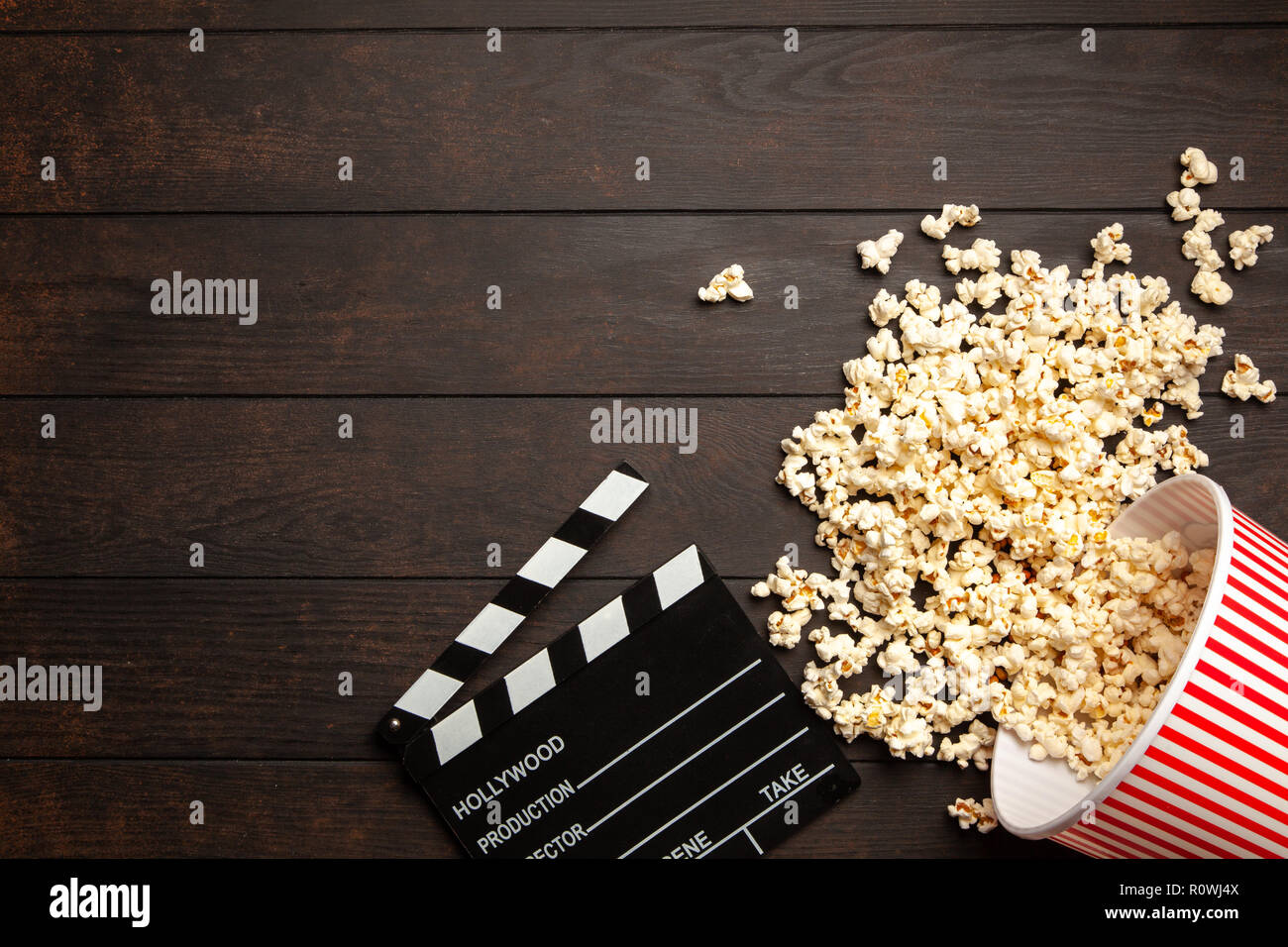 Full popcorn bucket on a dark background Stock Photo - Alamy