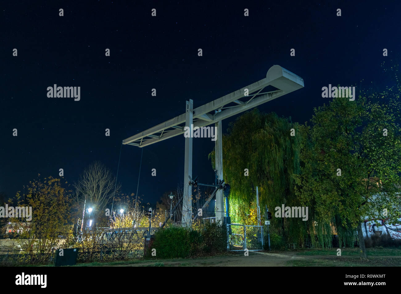White dutch drawbridge at Humboldt Harbour in Berlin Tegel at night ...