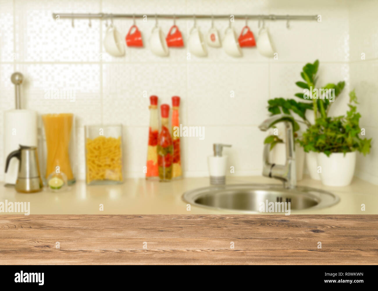 Wooden worktop on blur background Stock Photo - Alamy