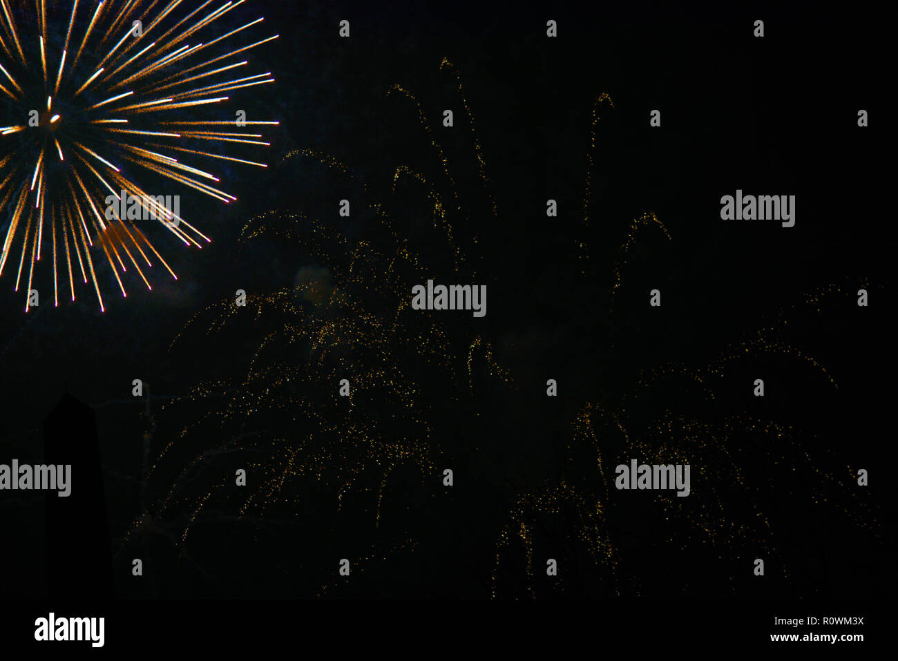 Bright, colorful fireworks in a dark night sky Stock Photo - Alamy