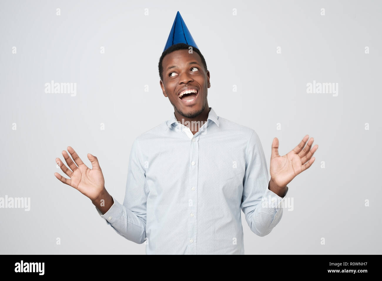 Cheerful celebrating african boy enjoying successful party Stock Photo ...