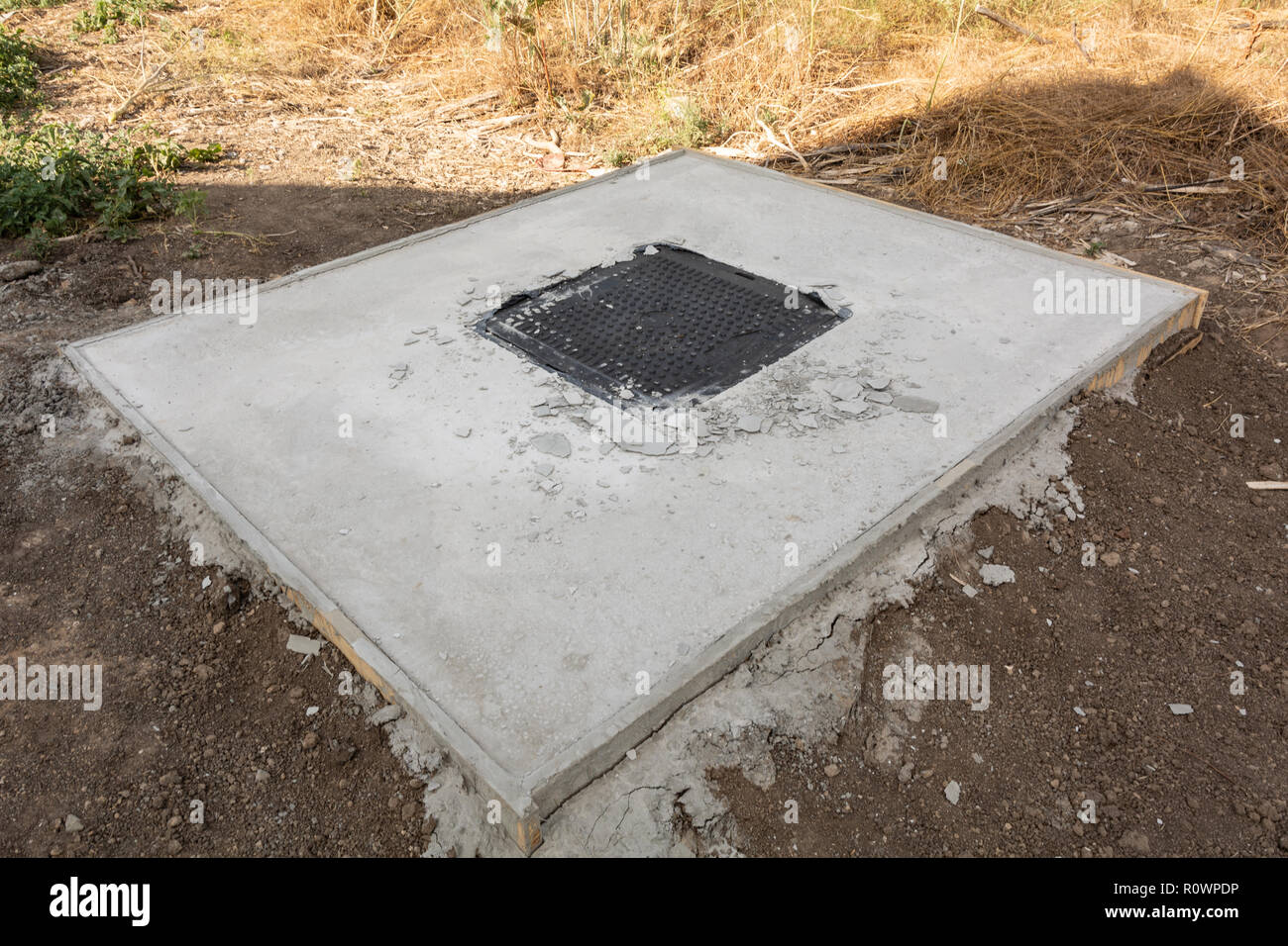 The hatch on a pit for a septic tank. Sewerage construction Stock Photo ...