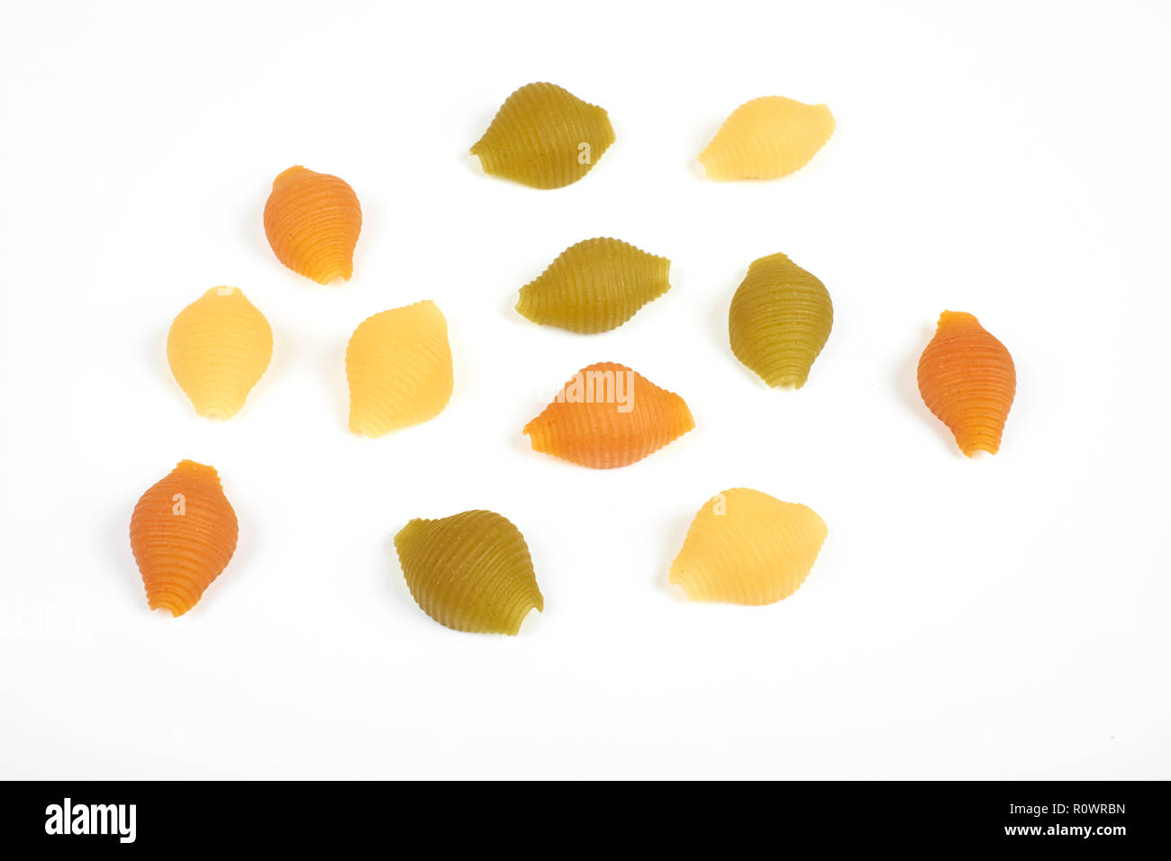 Shell pasta on white background, top view Stock Photo - Alamy