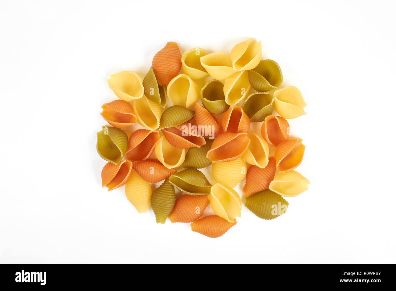 Shell pasta on white background, top view Stock Photo - Alamy