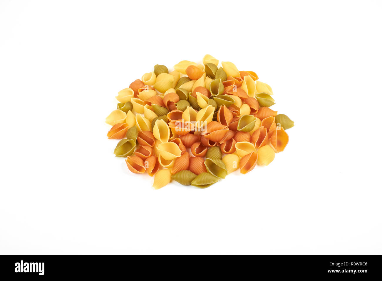 Shell pasta on white background, top view Stock Photo - Alamy