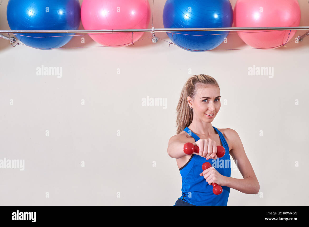 Dumbbell female pose hi-res stock photography and images - Alamy