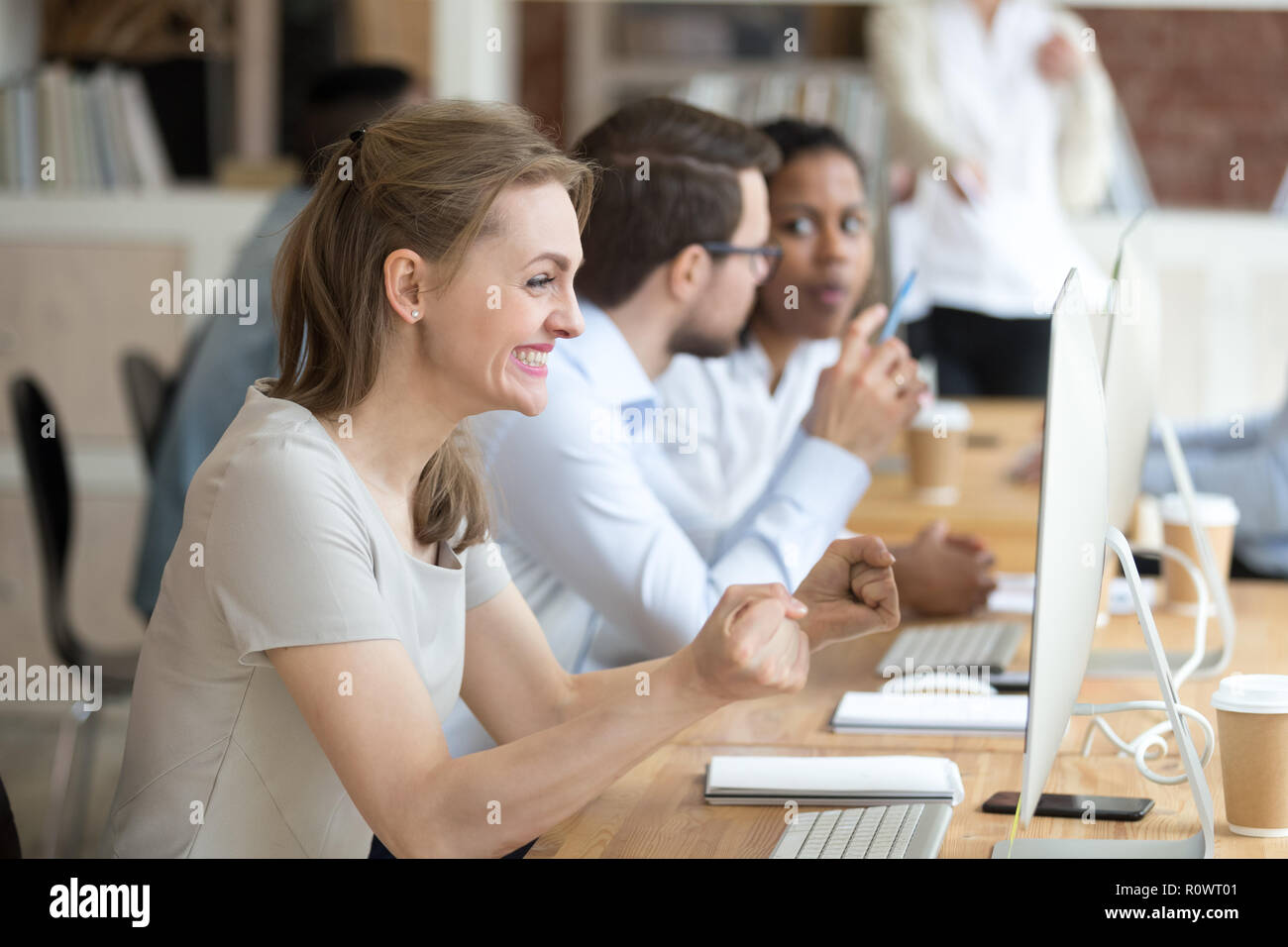 Excited female employee triumph getting promotion letter Stock Photo ...