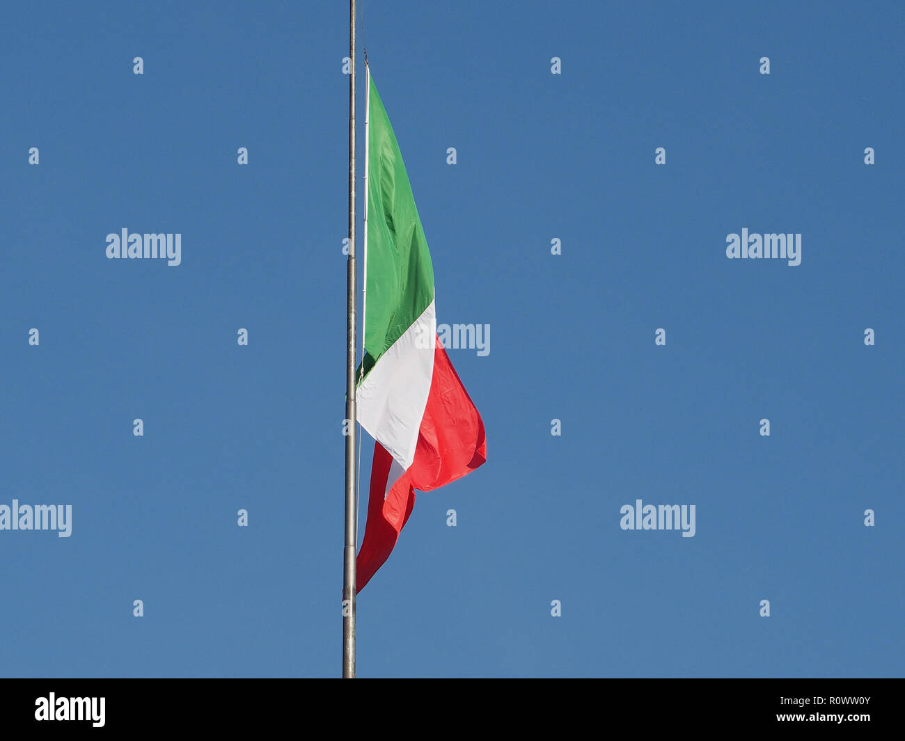 the Italian national flag of Italy, Europe over blue sky Stock Photo ...
