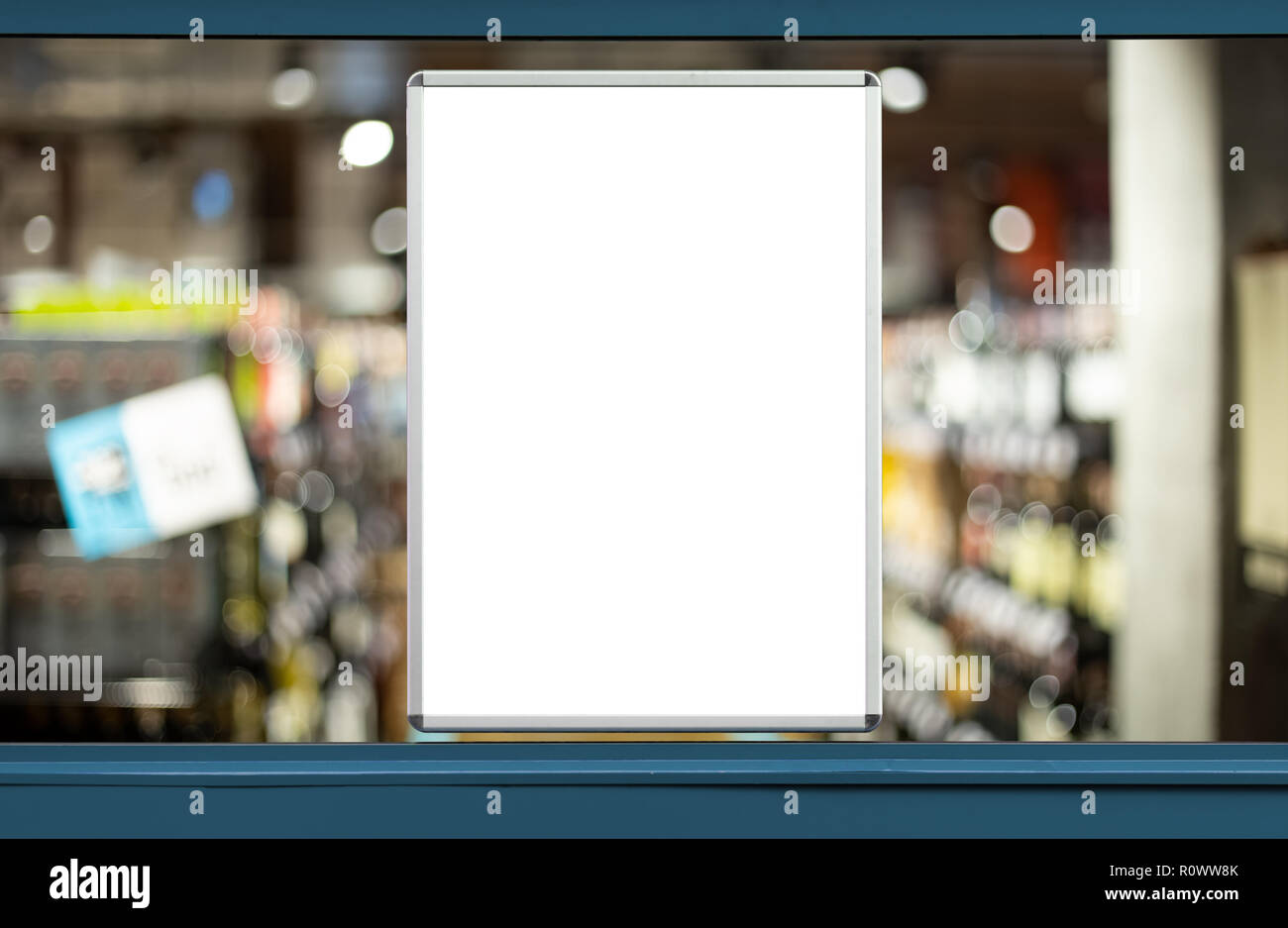 Empty advertising board in liquor store showcase Stock Photo - Alamy