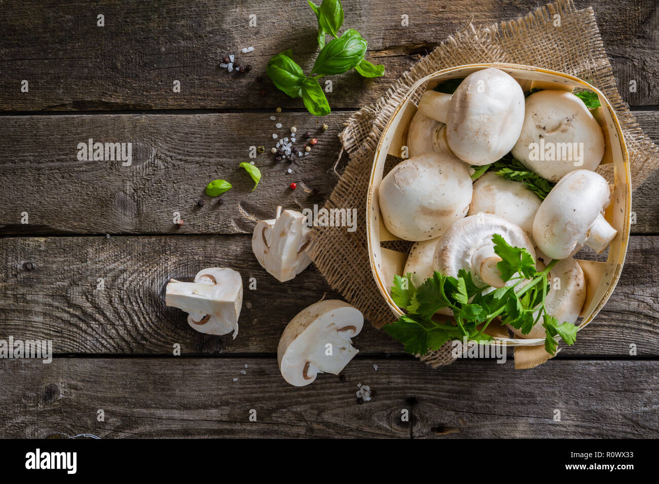 Mushrooms on rustic wood background Stock Photo - Alamy