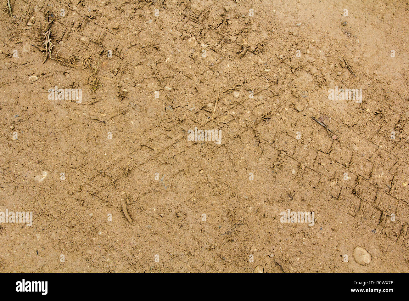 Tire tracks on a wet muddy road, abstract background Stock Photo - Alamy