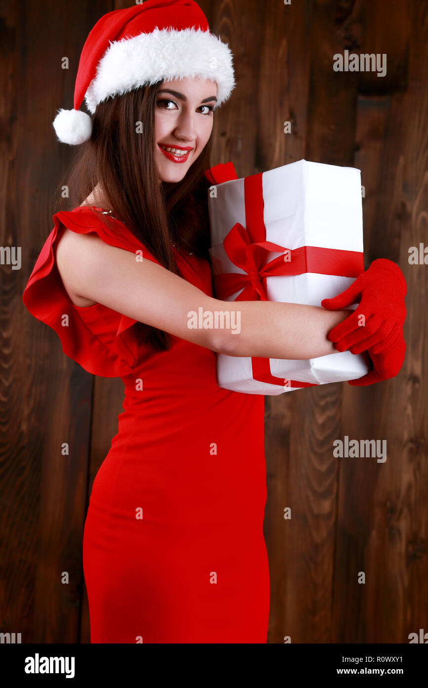 Portrait of young smiling female hold gift Stock Photo - Alamy