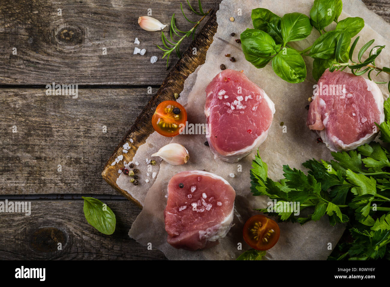 Raw filet mignon meat cuts with spice and herbs Stock Photo - Alamy