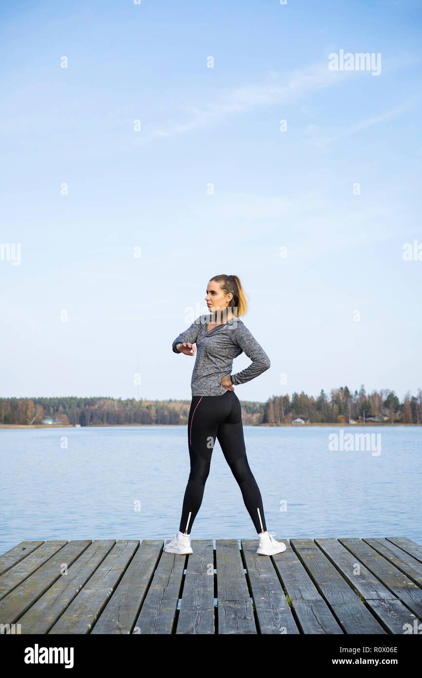 Caucasian blonde Scandinavian fitness girl outdoors in Sweden ...