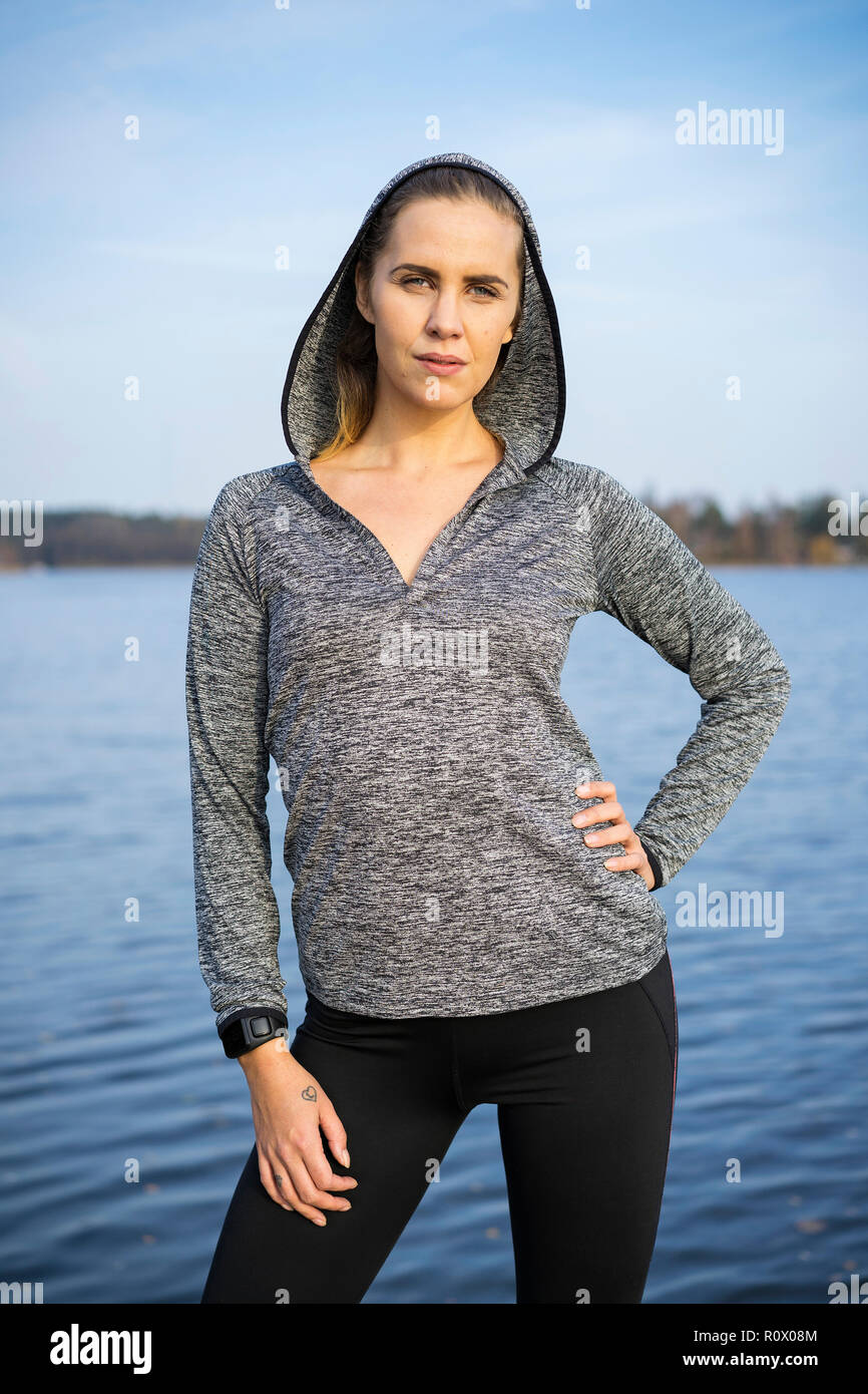 Caucasian blonde Scandinavian fitness girl outdoors in Sweden ...