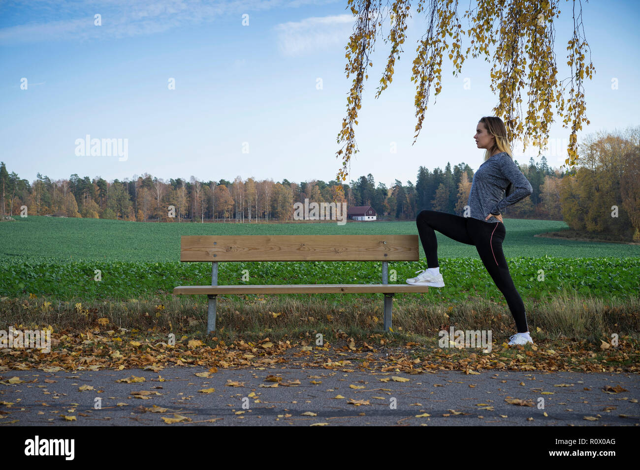 Caucasian blonde Scandinavian fitness girl outdoors in Sweden ...