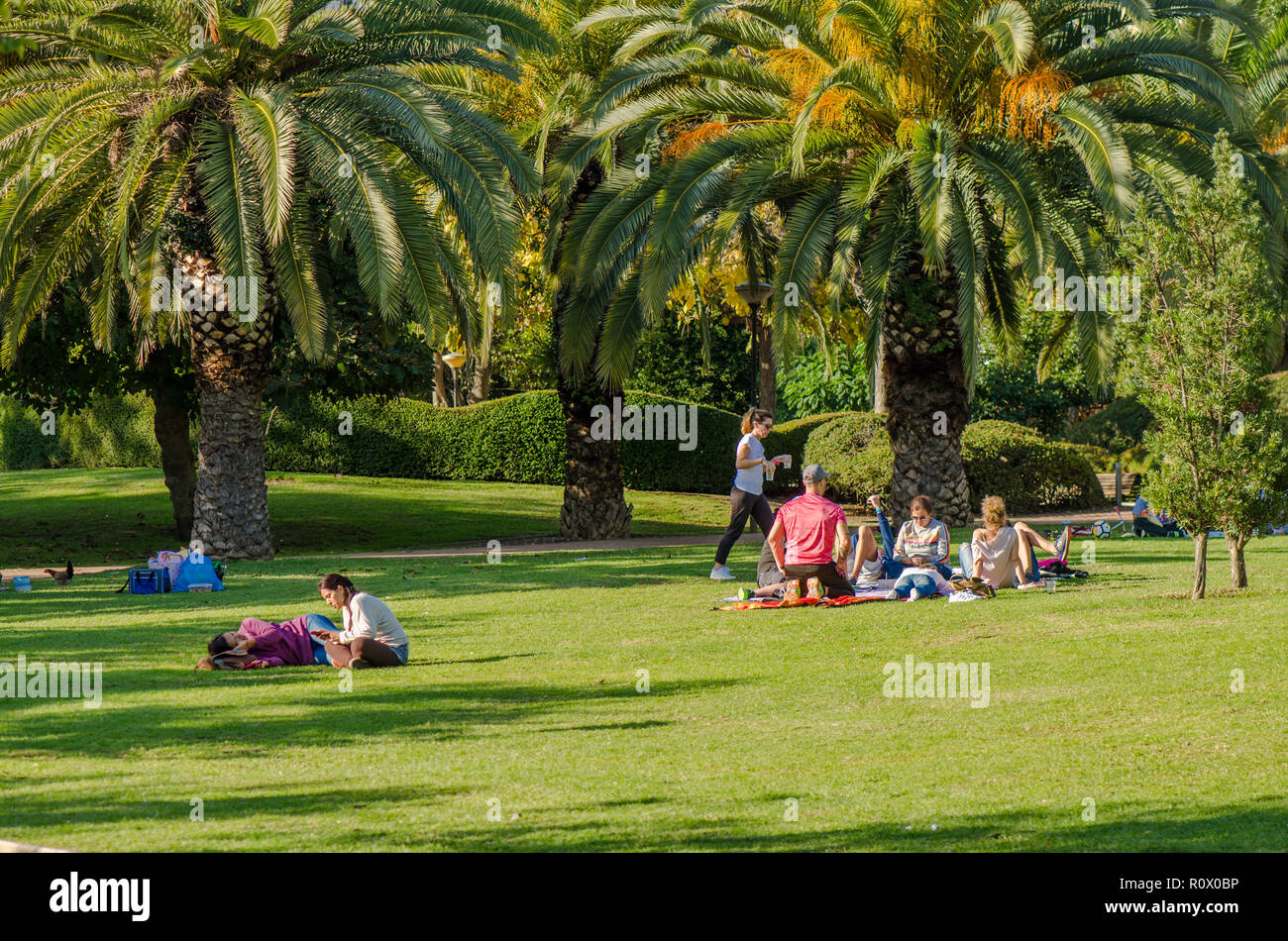 Family and couple enjoying afternoon in park, Parque de la Paloma ...