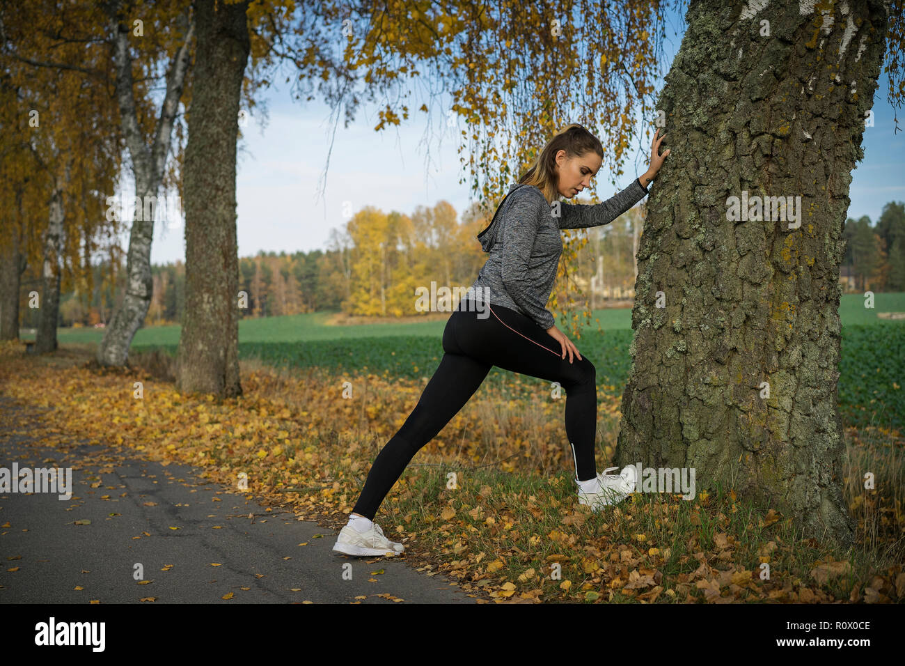 Caucasian blonde Scandinavian fitness girl outdoors in Sweden ...