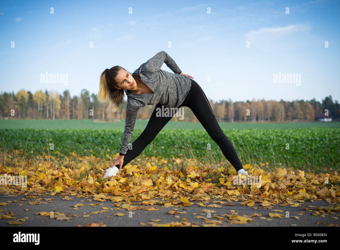 Caucasian blonde Scandinavian fitness girl outdoors in Sweden ...