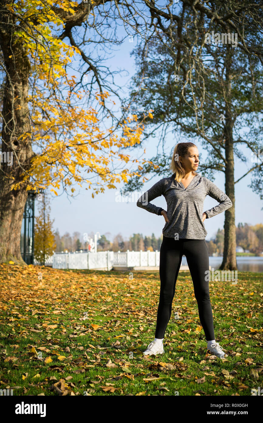 Caucasian blonde Scandinavian fitness girl outdoors in Sweden ...
