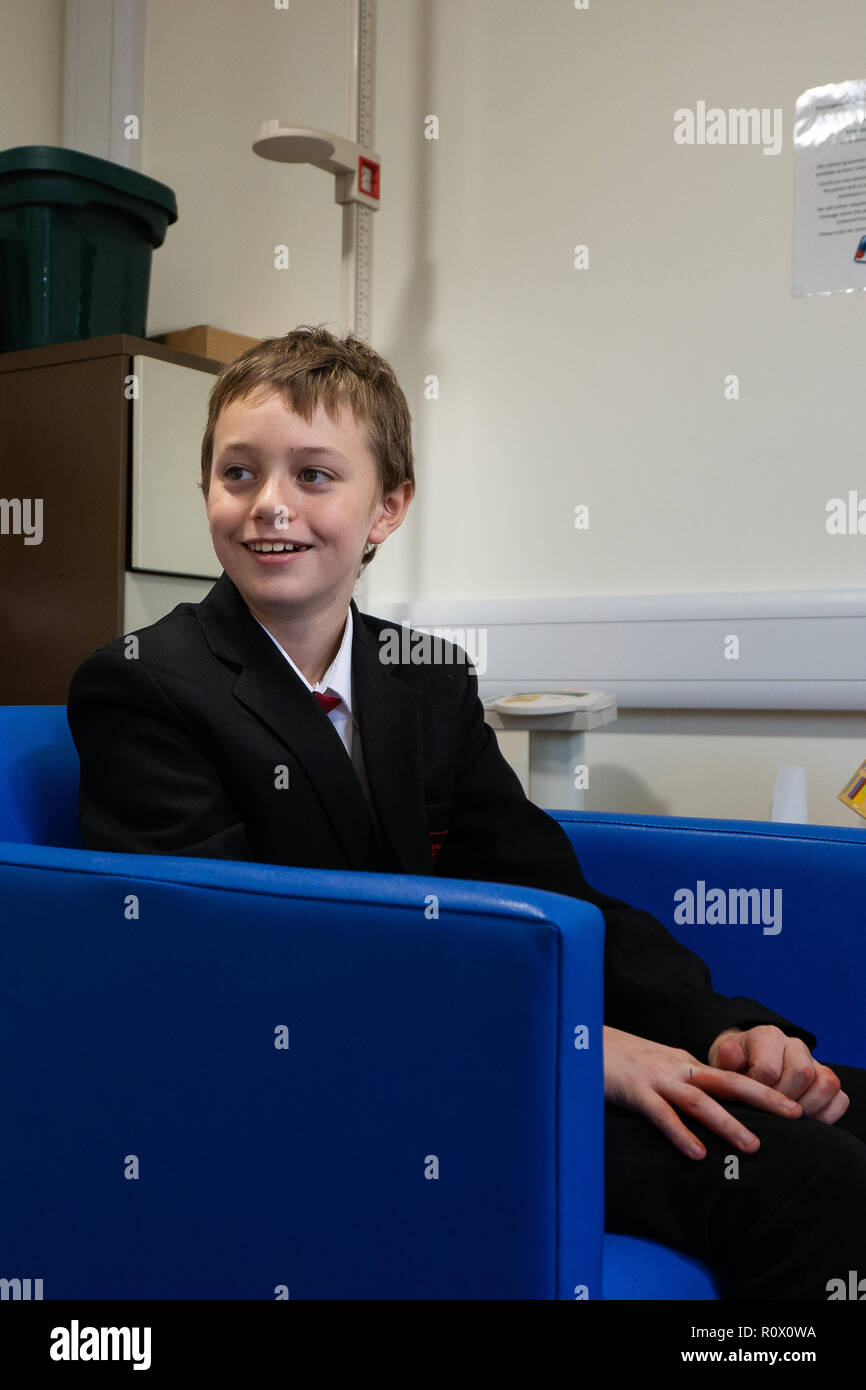 A young handsome boy with ADHD, Aspergers Syndrome, Autism talks to a ...