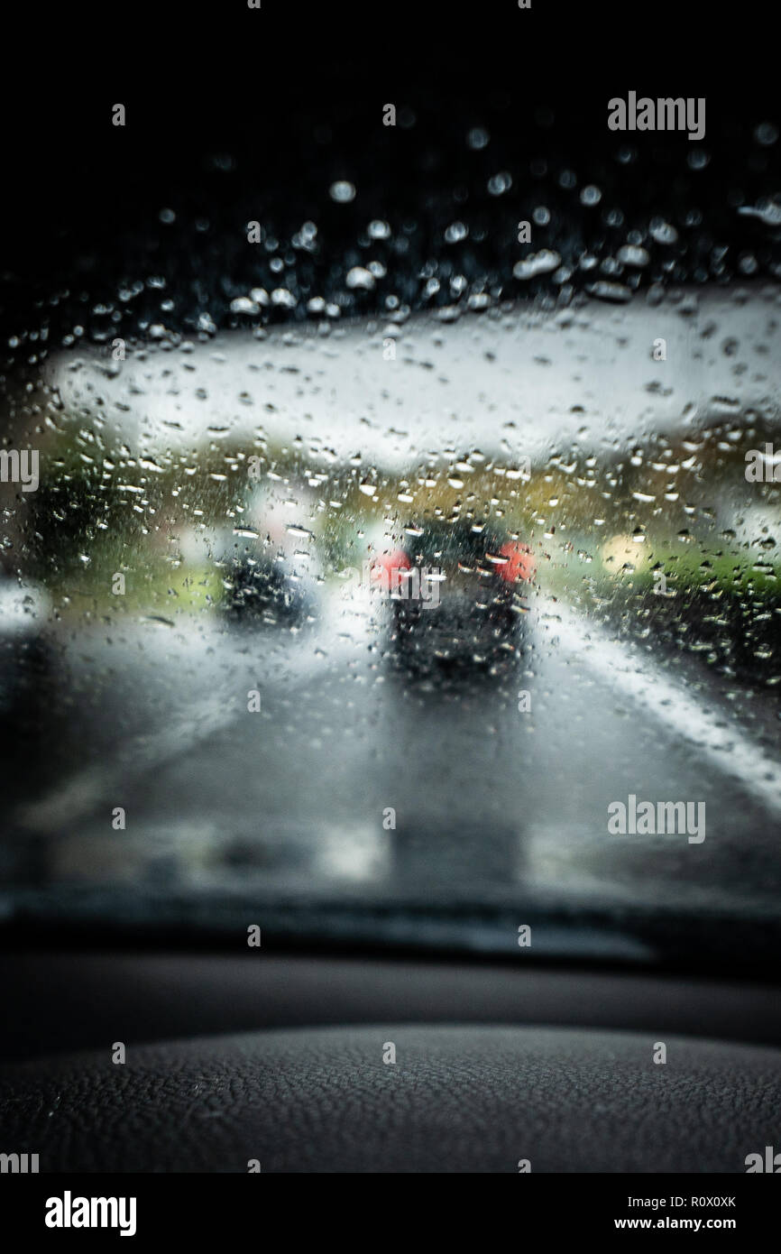 Rain on the motorway, heavy rain on the windshield, windscreen whilst ...