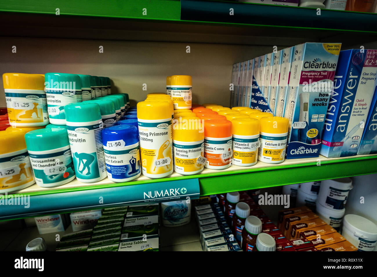 A selection of items on a shelf at the local chemist including multi ...