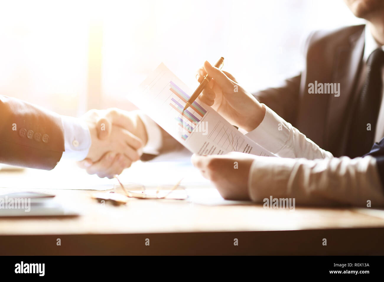close up.business partners at the Desk in the office Stock Photo - Alamy