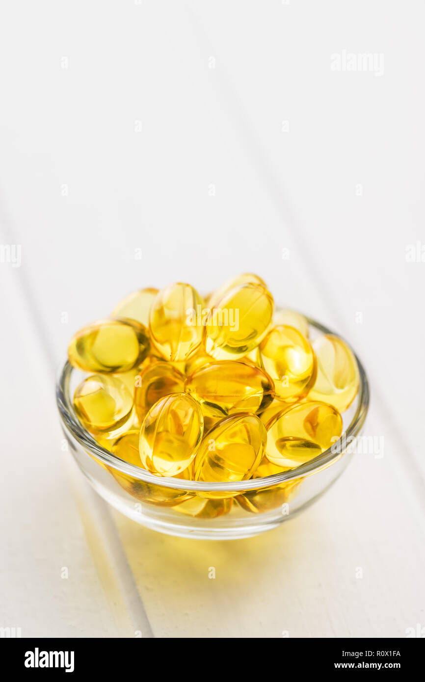 Omega 3 gel capsules on white table Stock Photo - Alamy