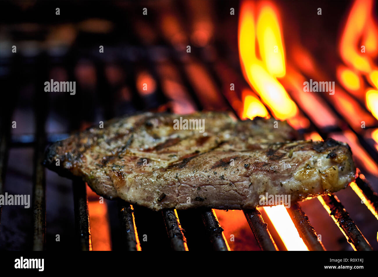 Delicious piece of meat on a BBQ grill Stock Photo - Alamy