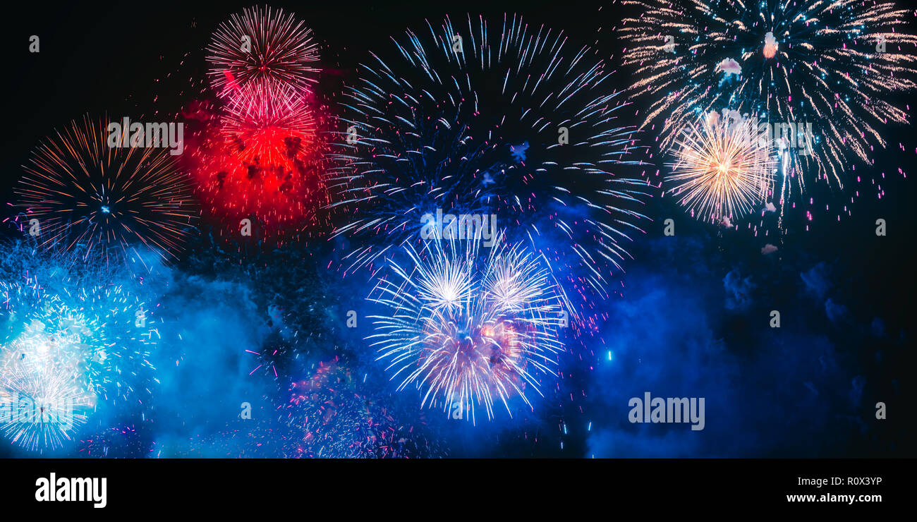 Colorful fireworks explosion on the black background Stock Photo - Alamy