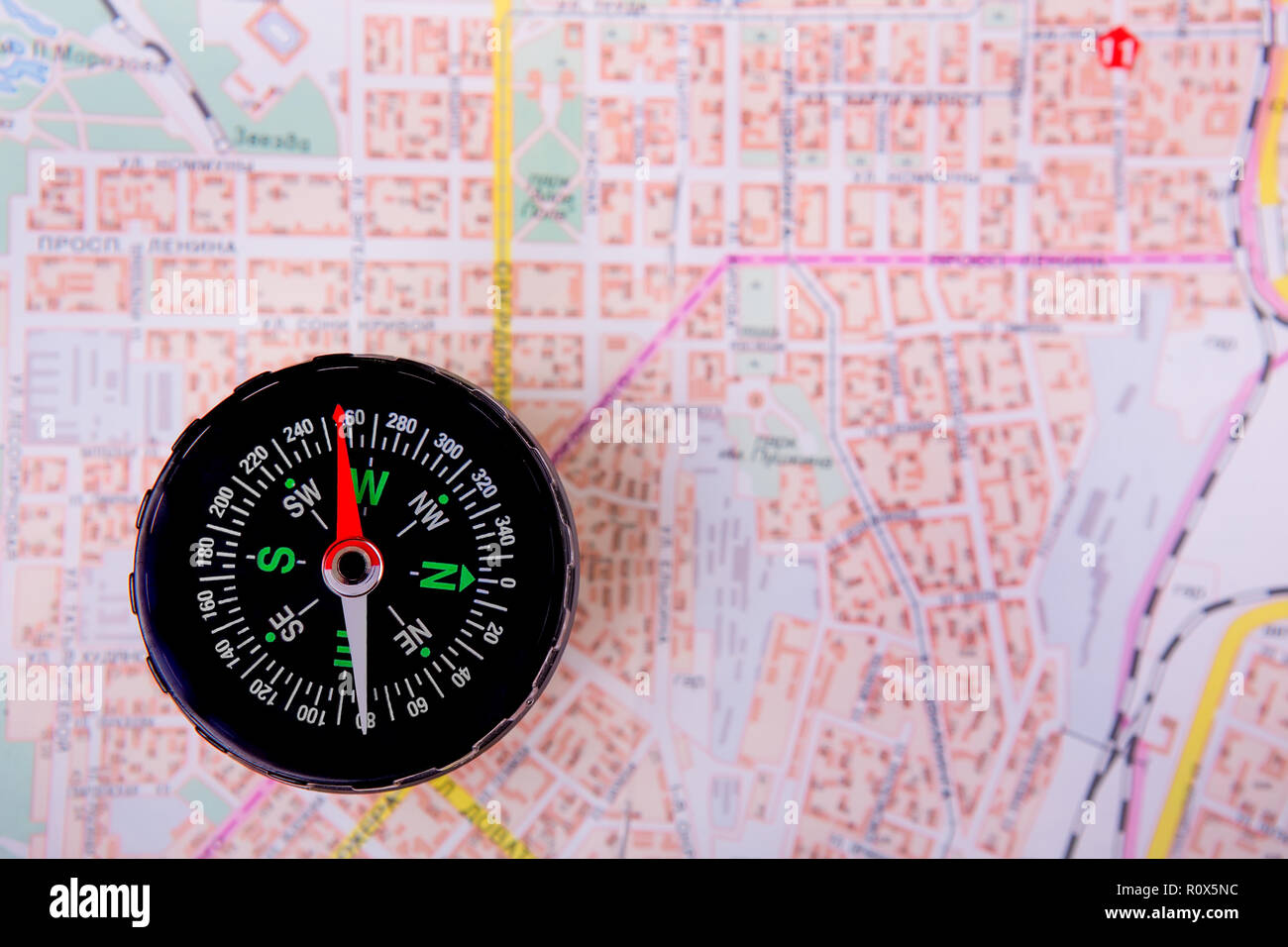 compass on a city map, close-up Stock Photo - Alamy