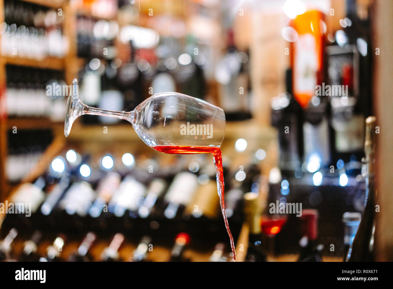Glass of Wine Falling Mid Air with Spill Stock Photo - Alamy