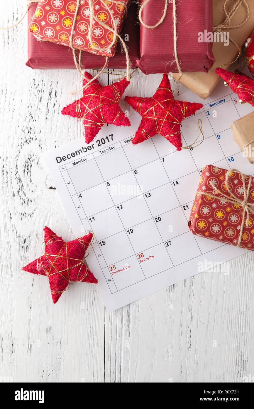 Decorations and calendar with Christmas Day marked out Stock Photo - Alamy
